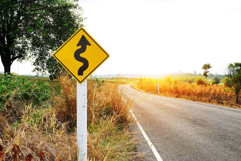 Left and right winding road sign